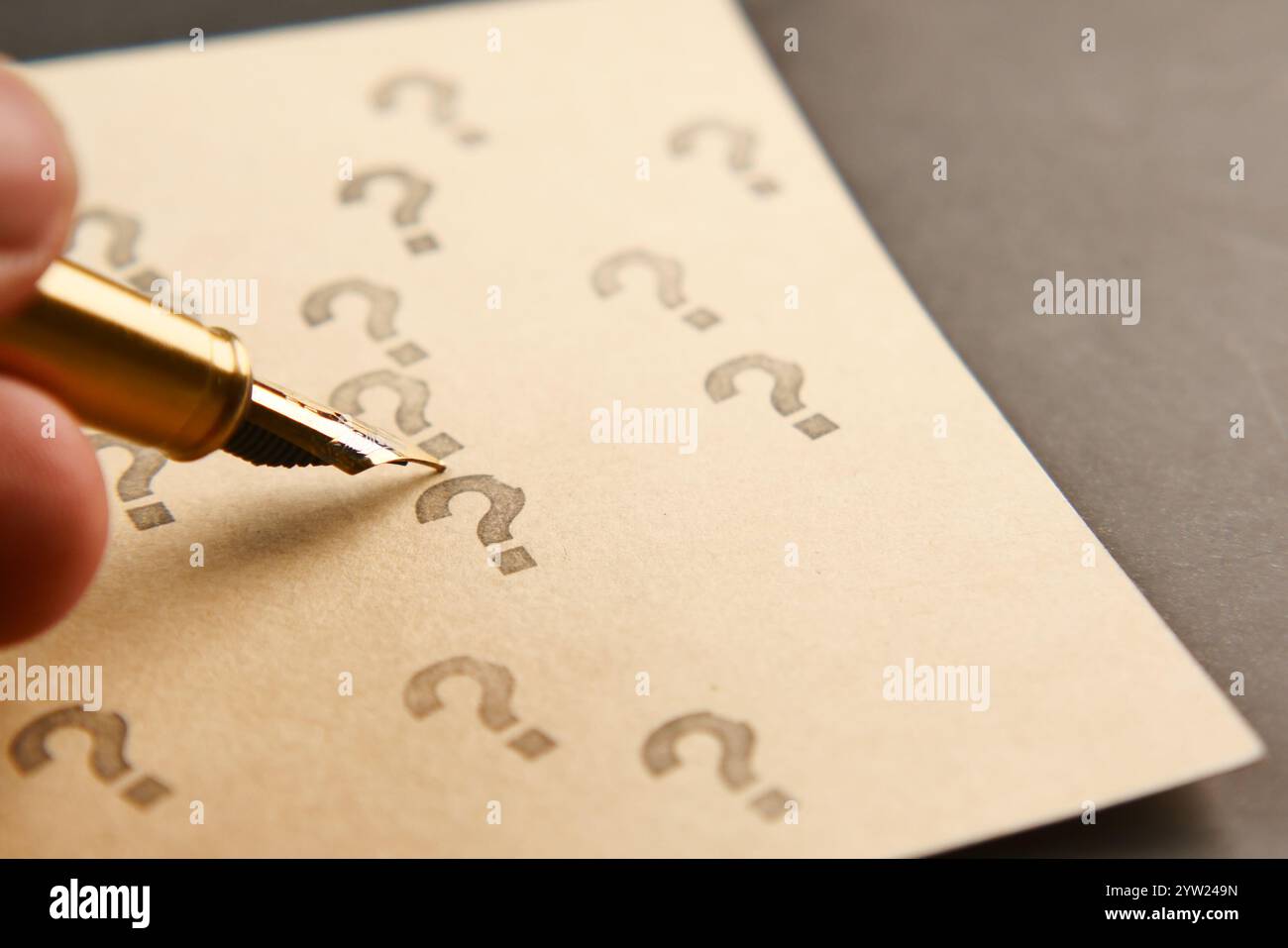 question mark on paper on office desk Stock Photo - Alamy
