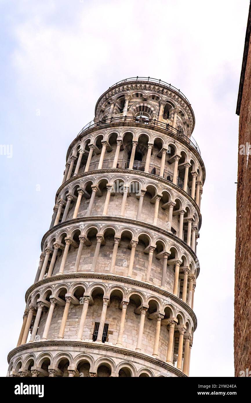 Leaning Tower of Pisa, Tuscany, Italy. For comparison a nearby building ...