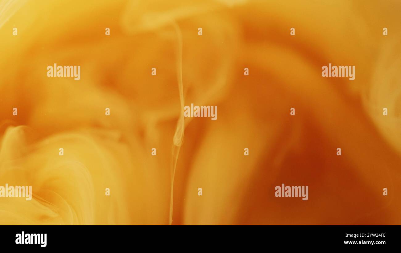 Cloud swirl. Paint splash. Defocused bright yellow orange ink mist ...