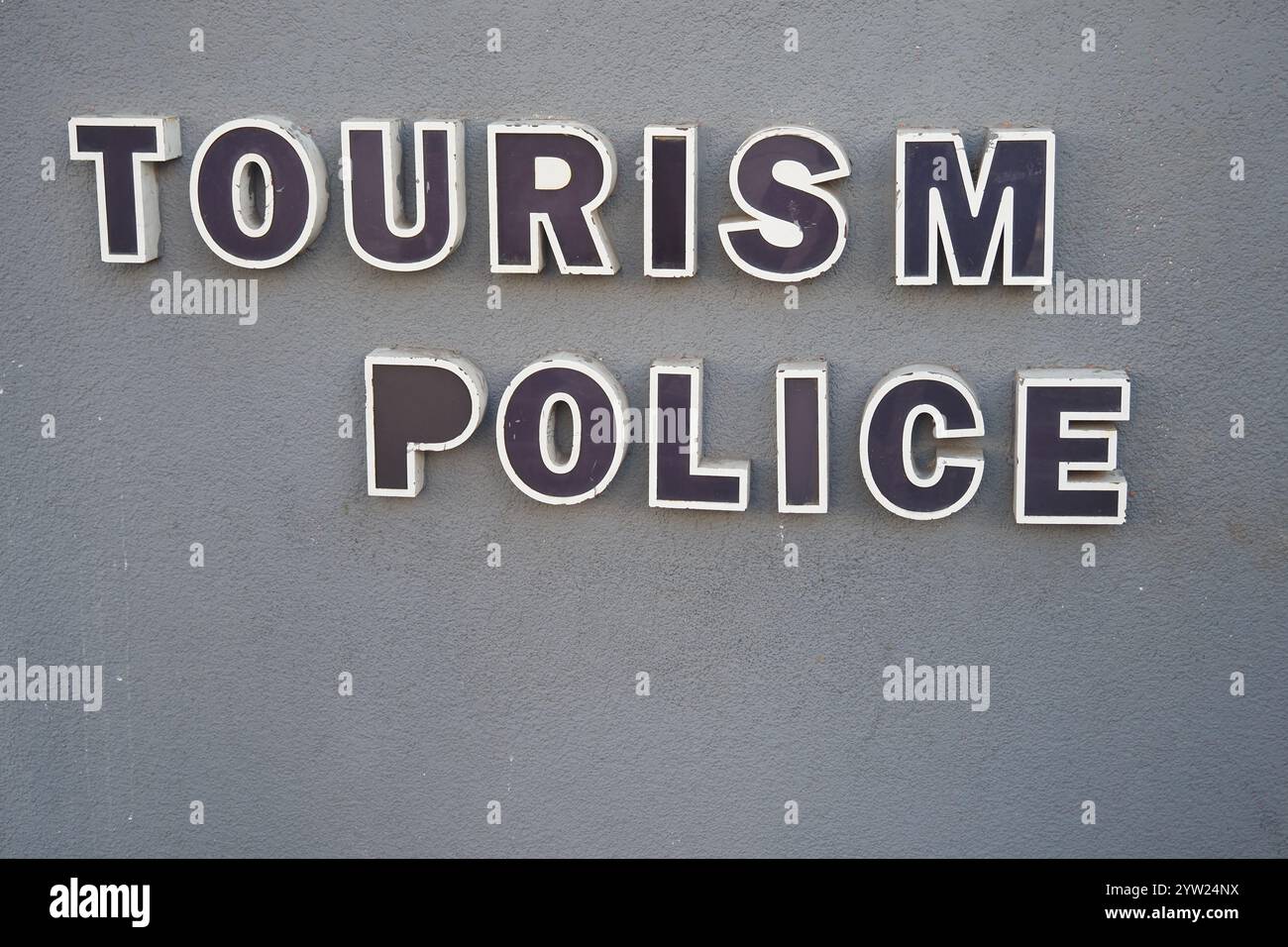 A visible sign for the Tourism Police prominently displayed on a ...