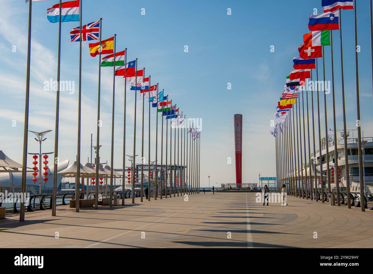 FEBRUARY 8, 2022, QINGDAO, CHINA: The flag alley and the Olympic light ...