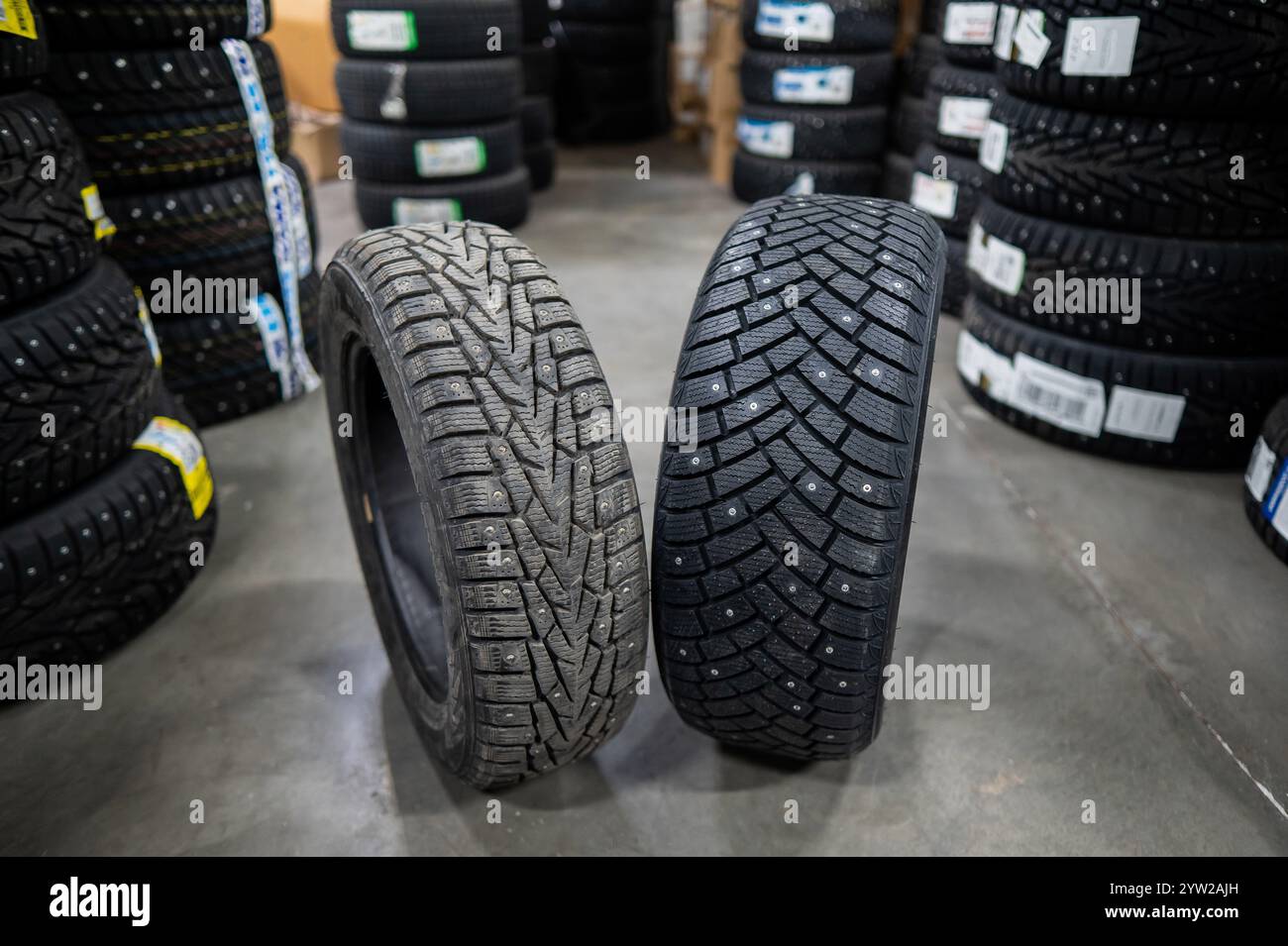 Comparison of old and new studded car tires Stock Photo - Alamy