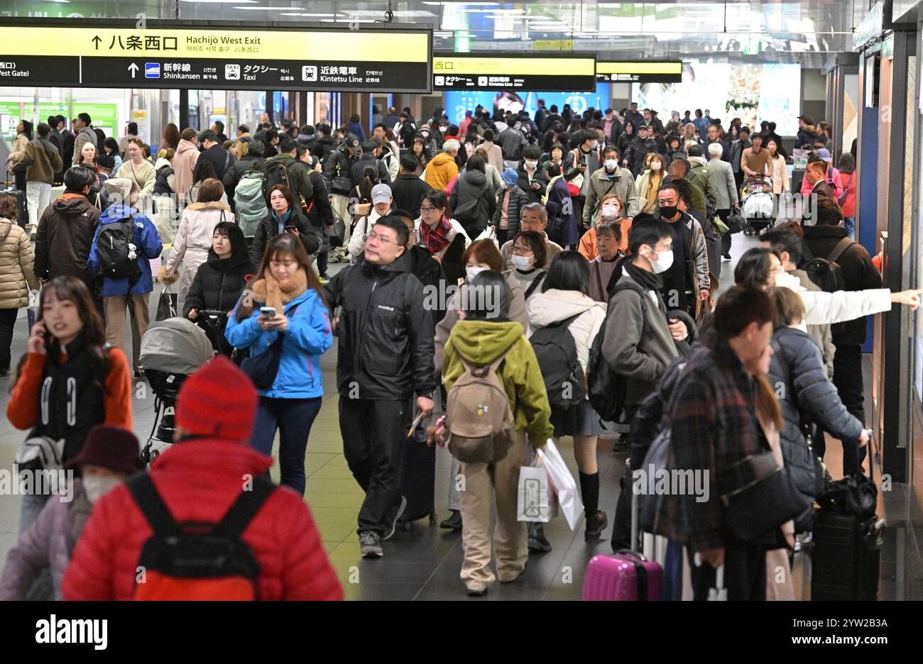 Lots of passengers including foreign tourists come and go through the north-south free passage ...