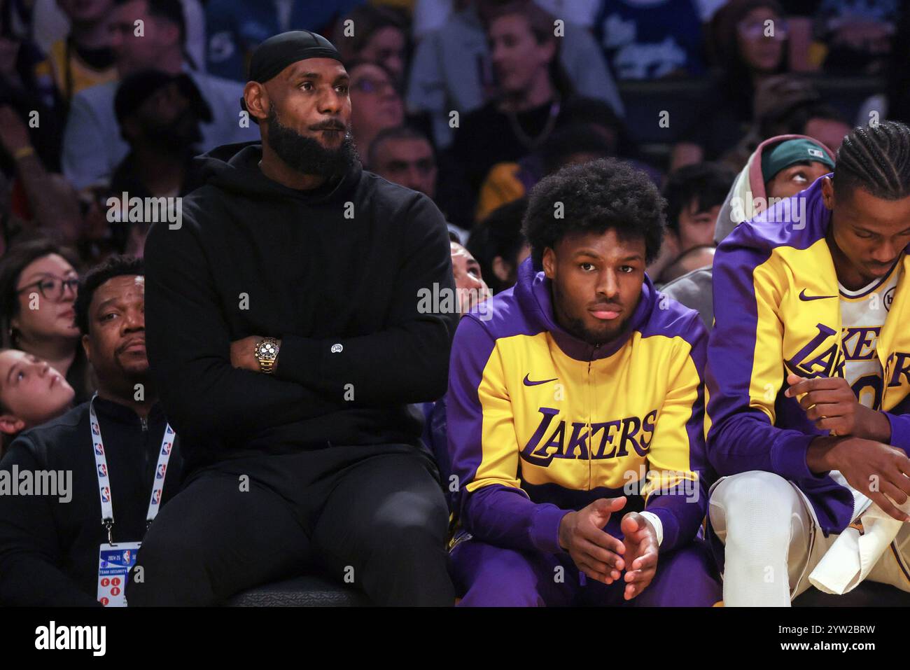 Los Angeles Lakers forward LeBron James, left, looks at the game from ...