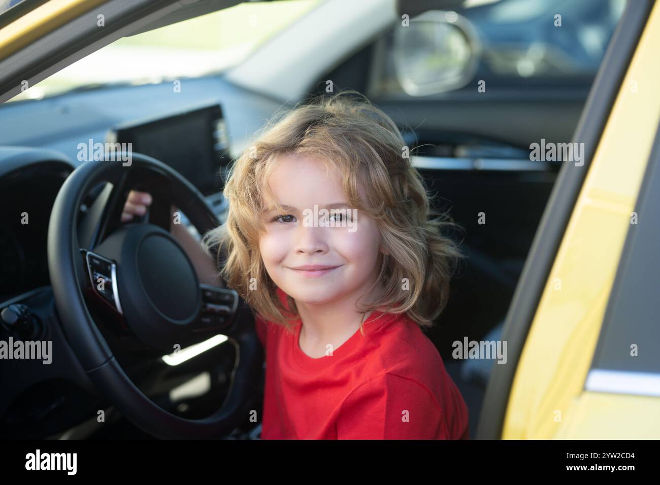 Little Driver. Cute little boy pretending to drive. Little kid driving ...