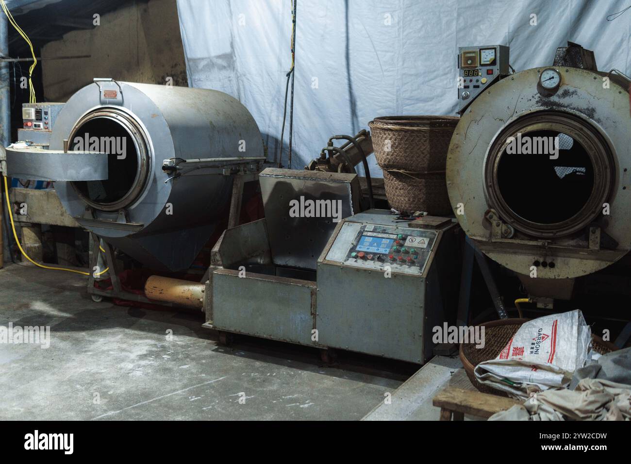Two industrial machines for drying or processing materials, showcasing ...