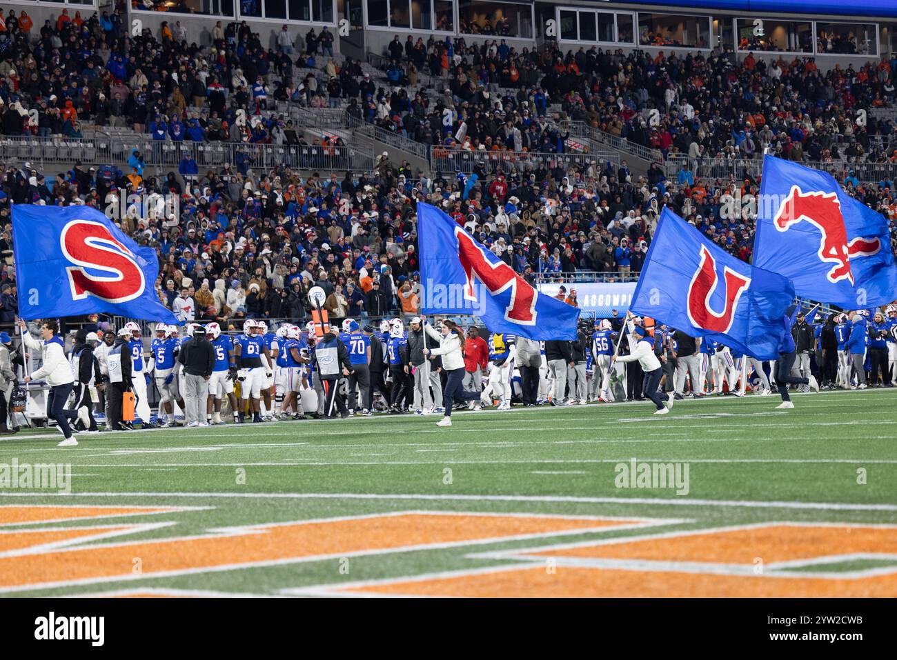 Charlotte, NC: Southern Methodist Mustangs cheerleaders run with the ...