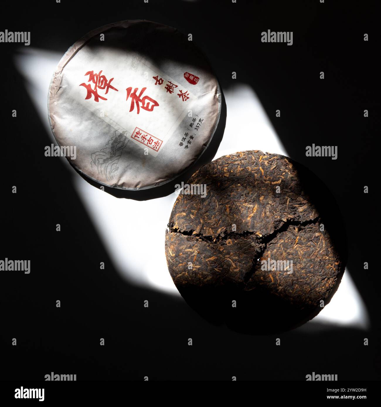 This authentic Puerh tea cake beautifully showcases its unique texture ...