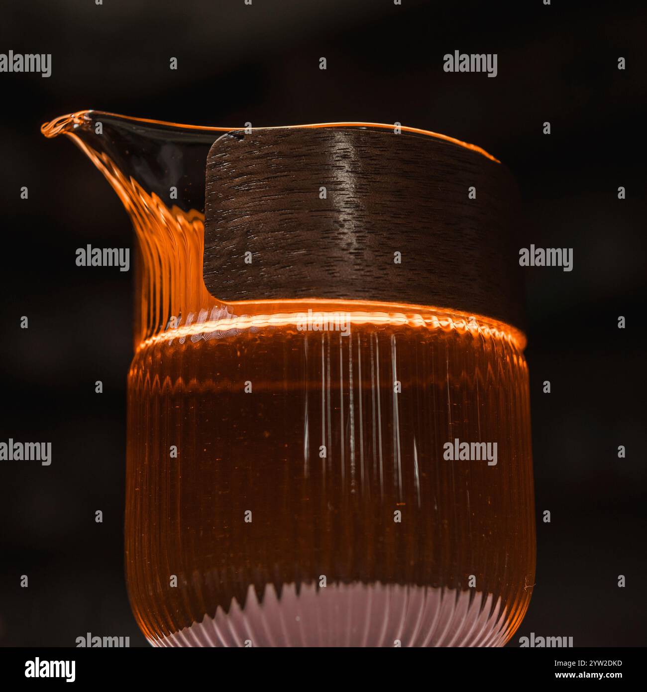 A beautifully stylish glass pitcher that is softly illuminated ...