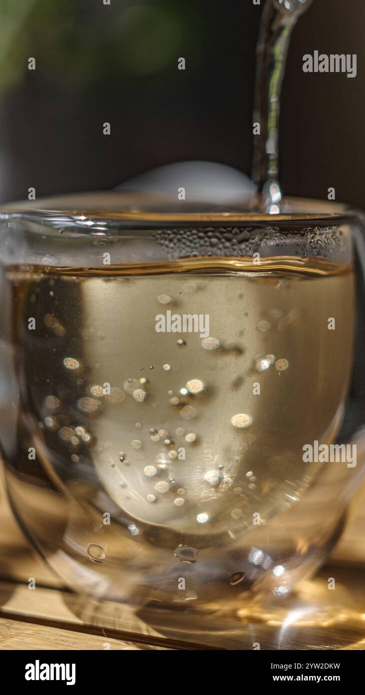 A detailed closeup image showcasing sparkling water filled with bubbles ...