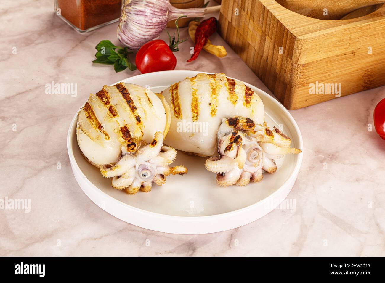 Grilled gourmet cuttlefish in the plate Stock Photo - Alamy