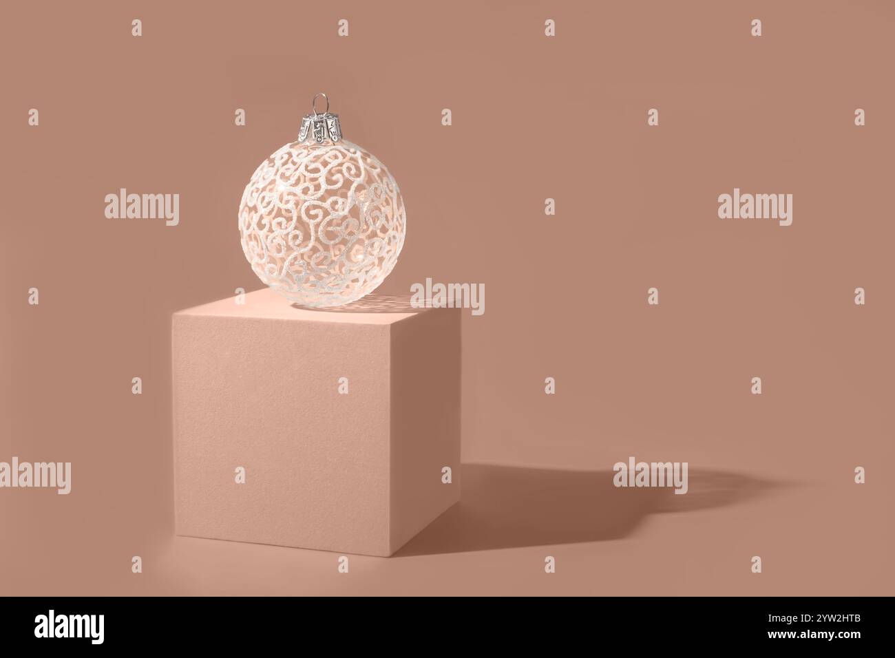 delicate beautiful white Christmas tree ball on a Mocha Mousse ...