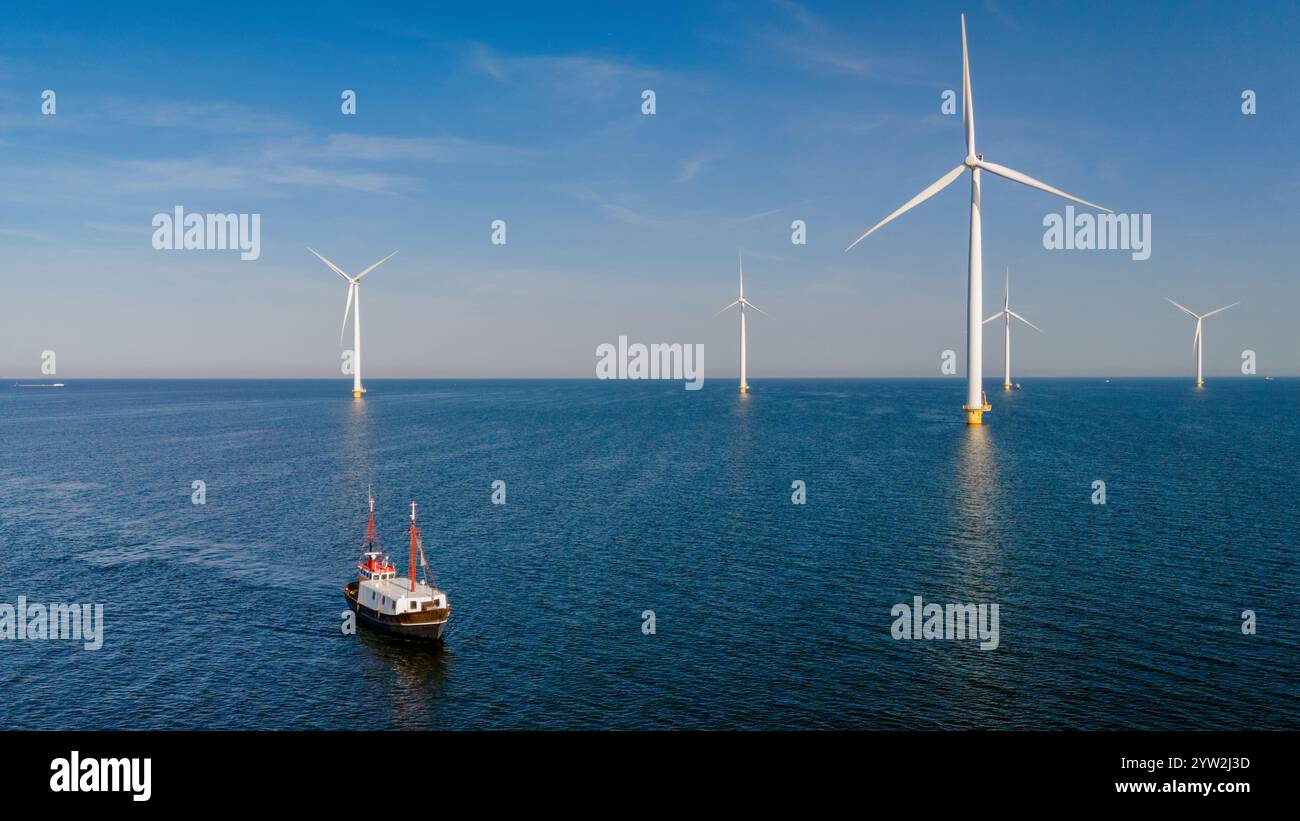 offshore windmill farm in ocean with fishing boat, Windmill turbines ...