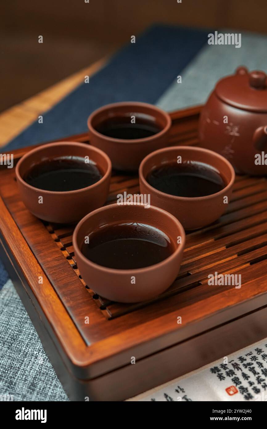 A beautifully serene display showcases a traditional tea setup that ...