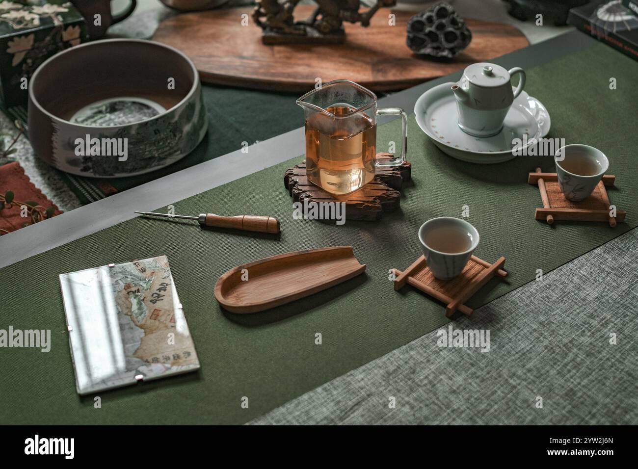 A serene tea setup featuring traditional teacups, an elegant teapot ...