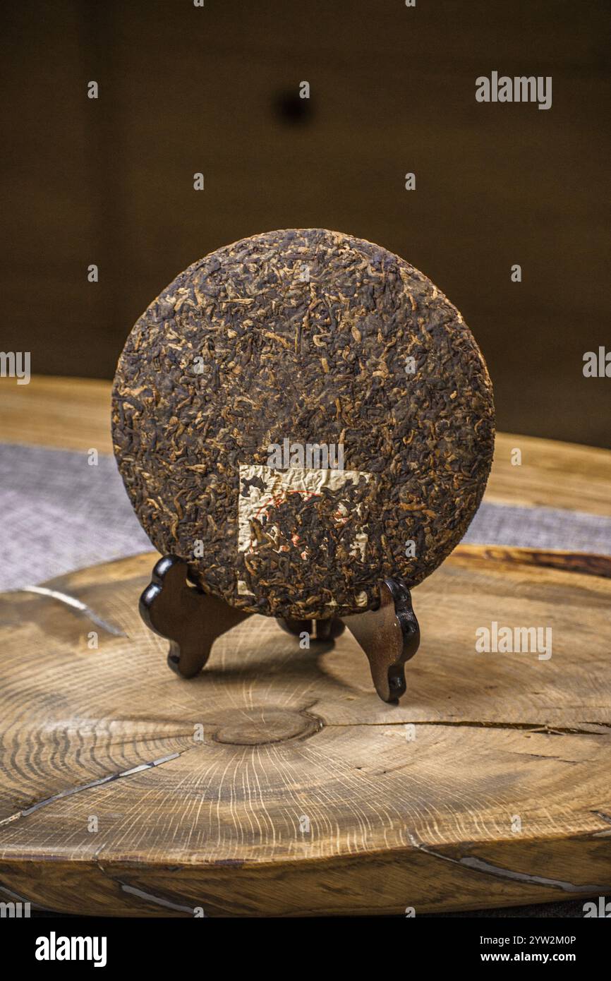 A beautifully shaped and expertly compressed tea cake is elegantly ...