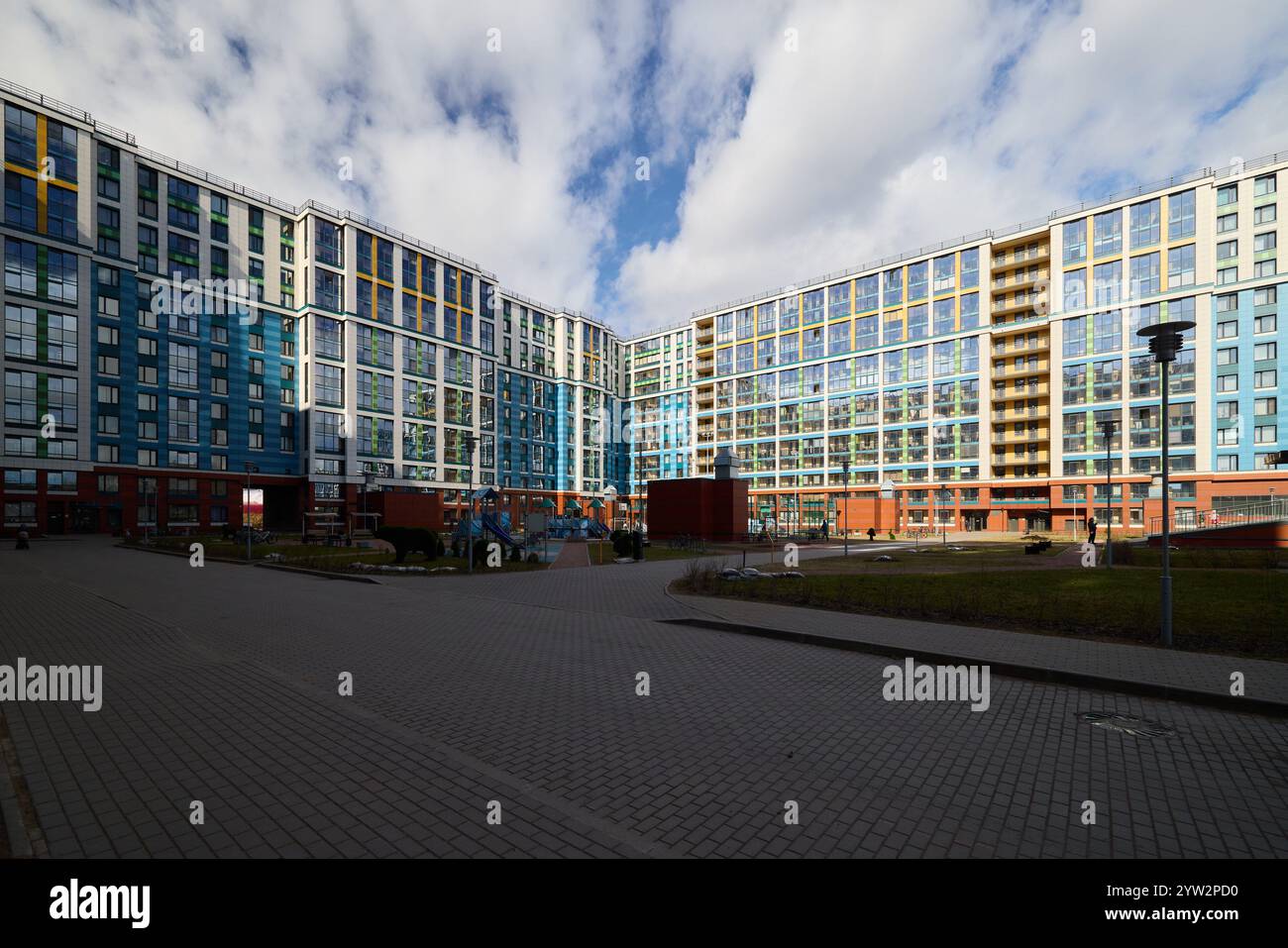 A Modern Urban Residential Complex featuring an eyecatching Blue Glass ...