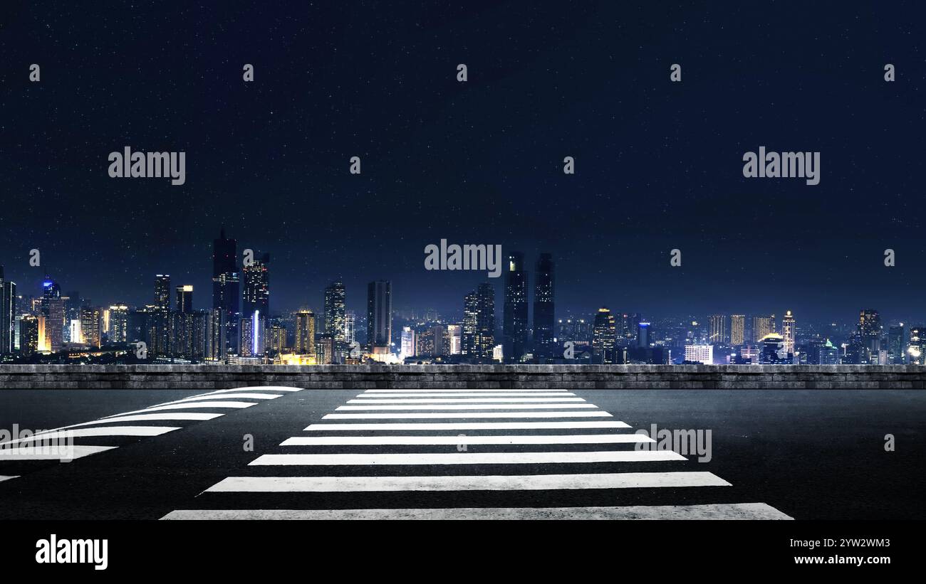 Empty asphalt road with pedestrian crosswalk and view of modern ...