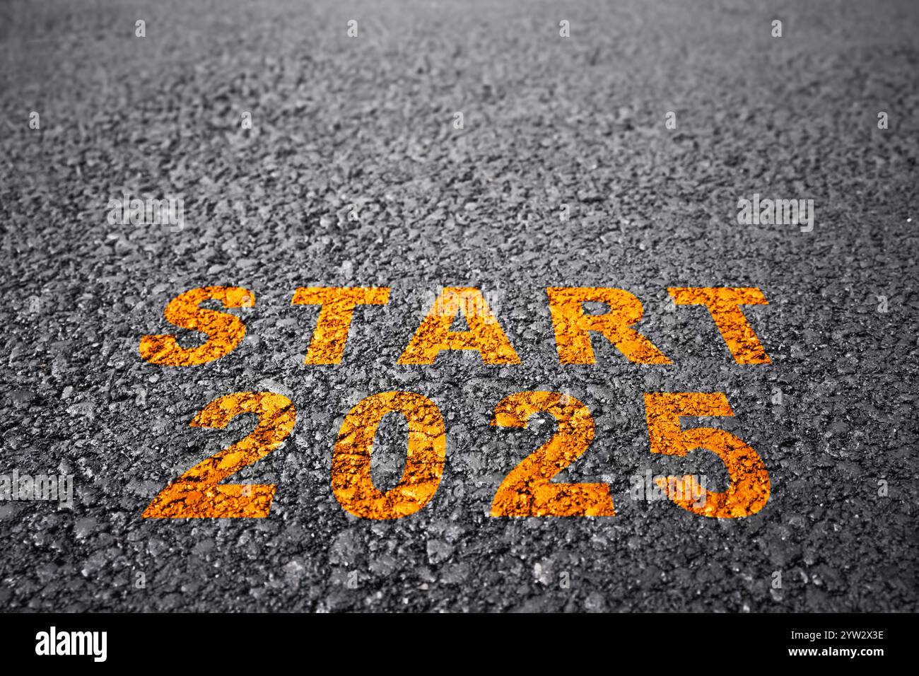 Top view of text of start 2025 written on asphalt road background ...