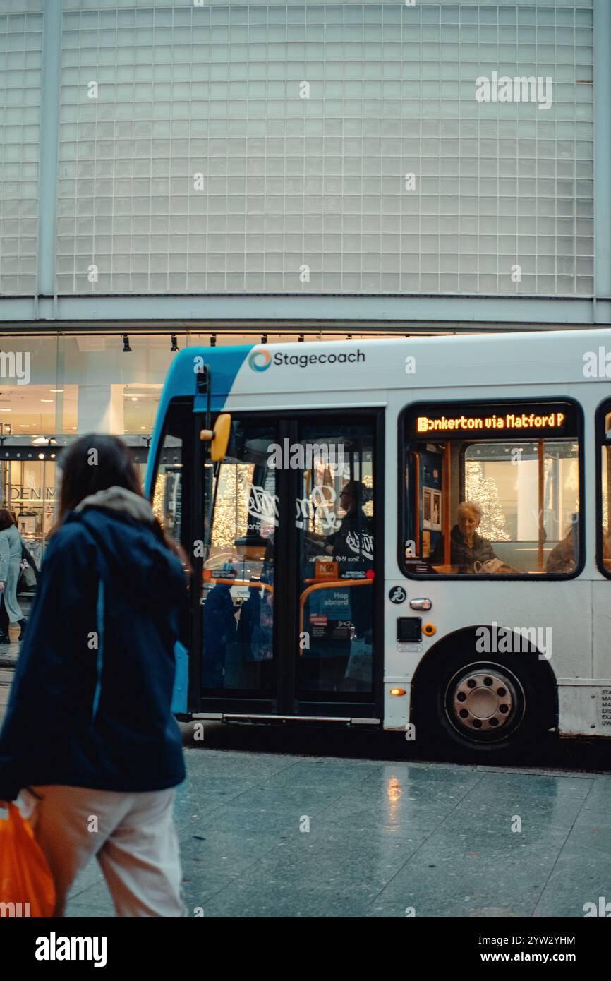Bus outside Next in the centre of Exeter in December on rainy day Stock ...