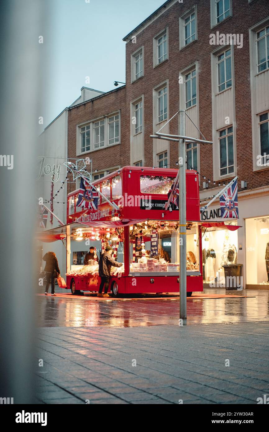 The Fudge Company red Christmas bus in Exeter, UK Stock Photo - Alamy