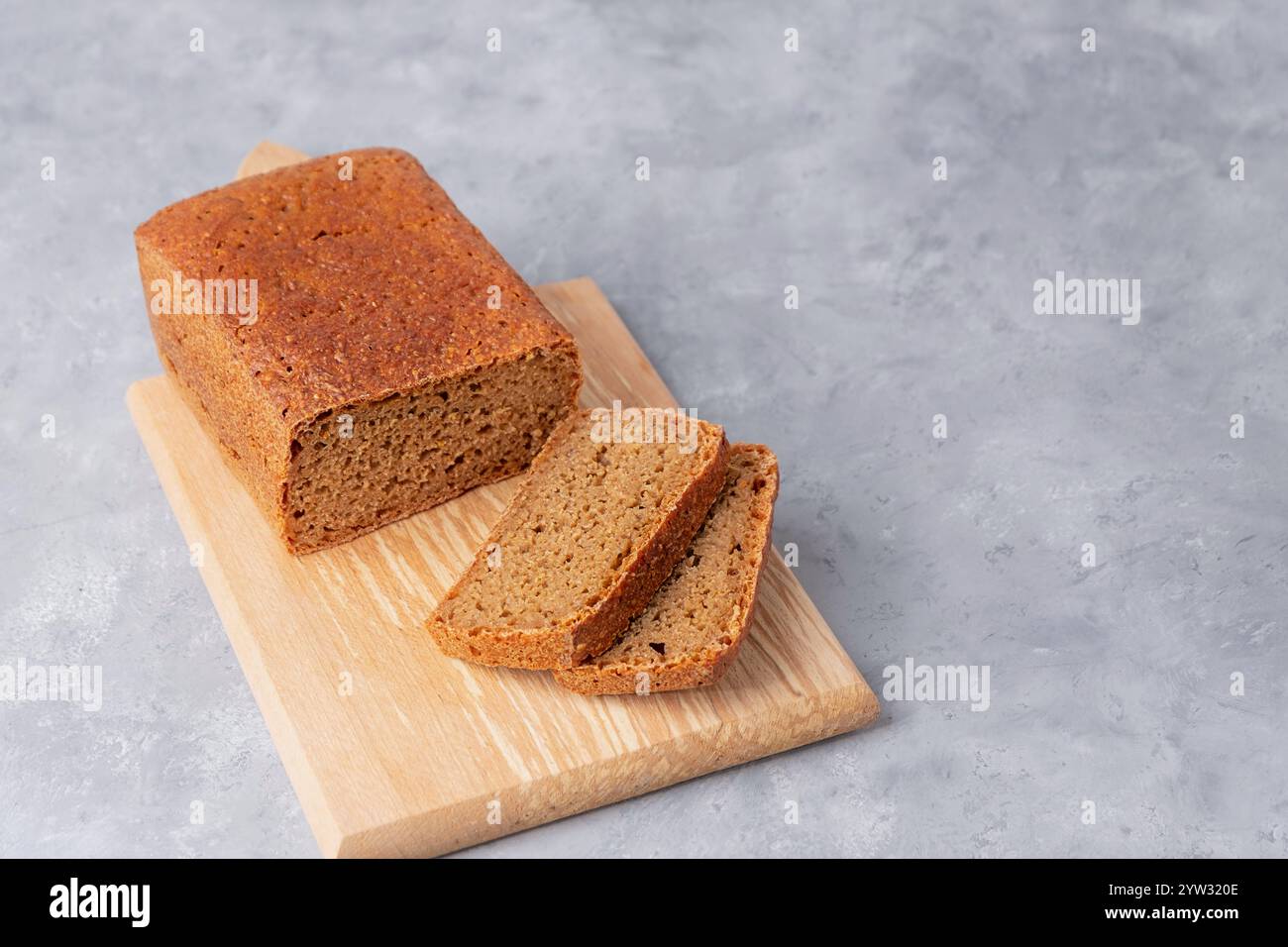 Homemade sourdough bread on neutral grey background with copy space ...