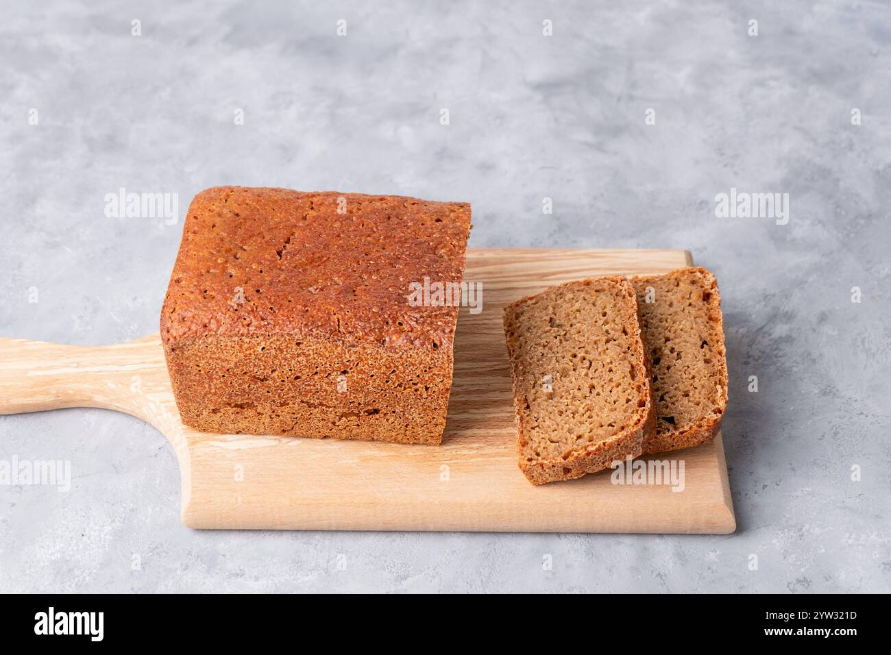 Homemade sourdough bread on neutral grey background with copy space ...
