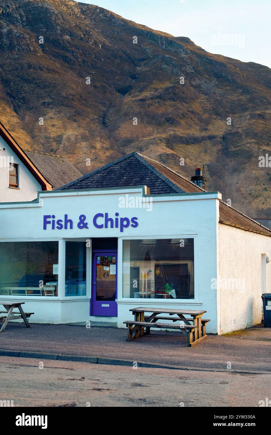 White fish chips restaurant set mountain backdrop early evening light ...