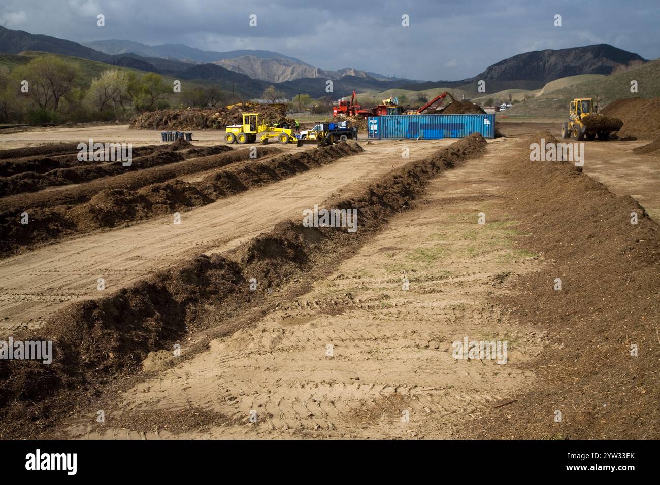 Composting yard waste to make mulch Stock Photo - Alamy