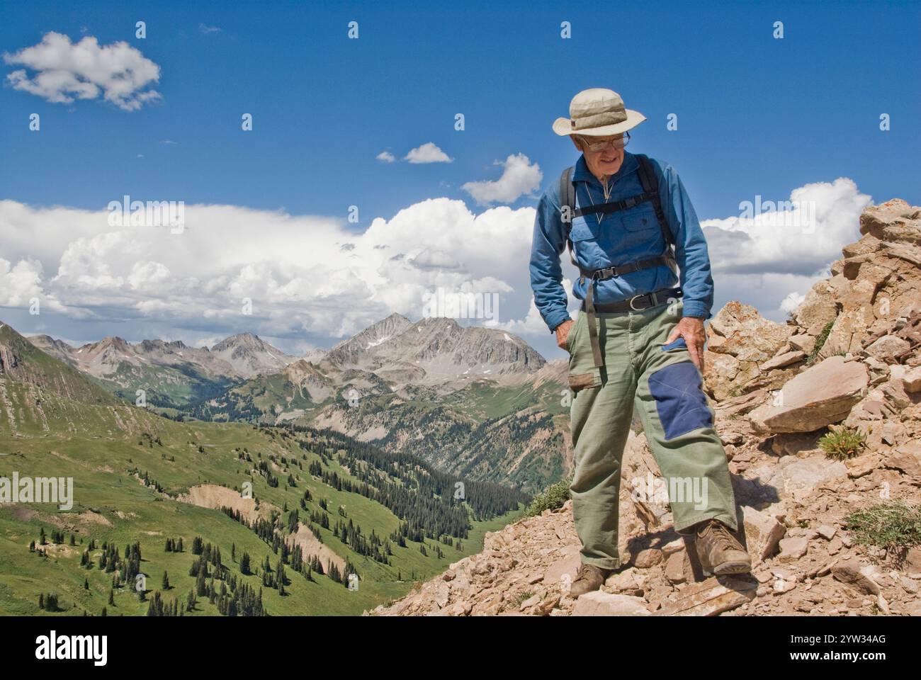 A man day hikes in the Snowmass-Maroon Bells Wilderness, CO Stock Photo ...