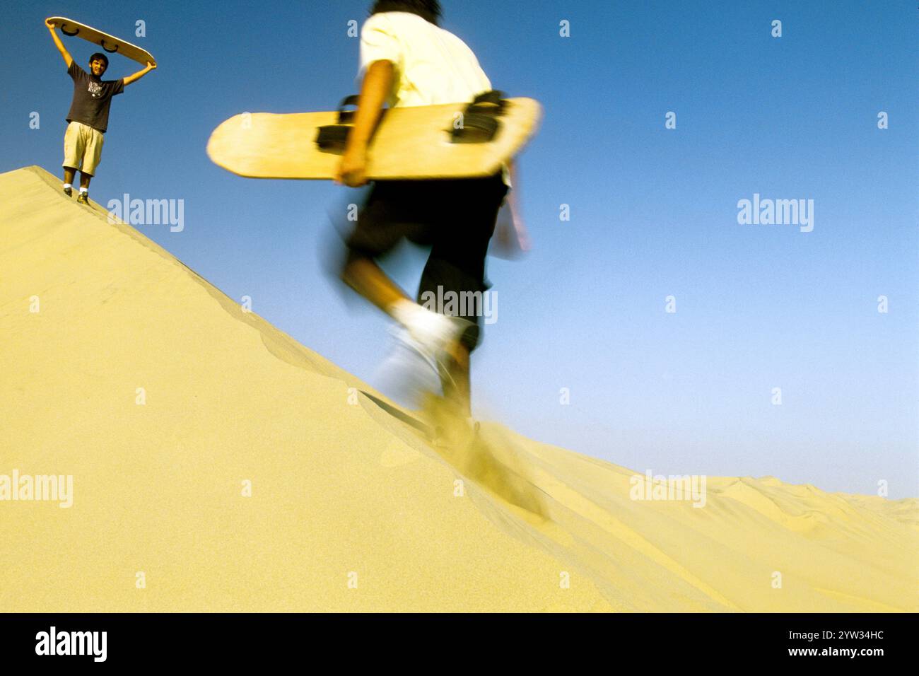 Two local sandboarders in the Ica Desert, Peru Stock Photo - Alamy