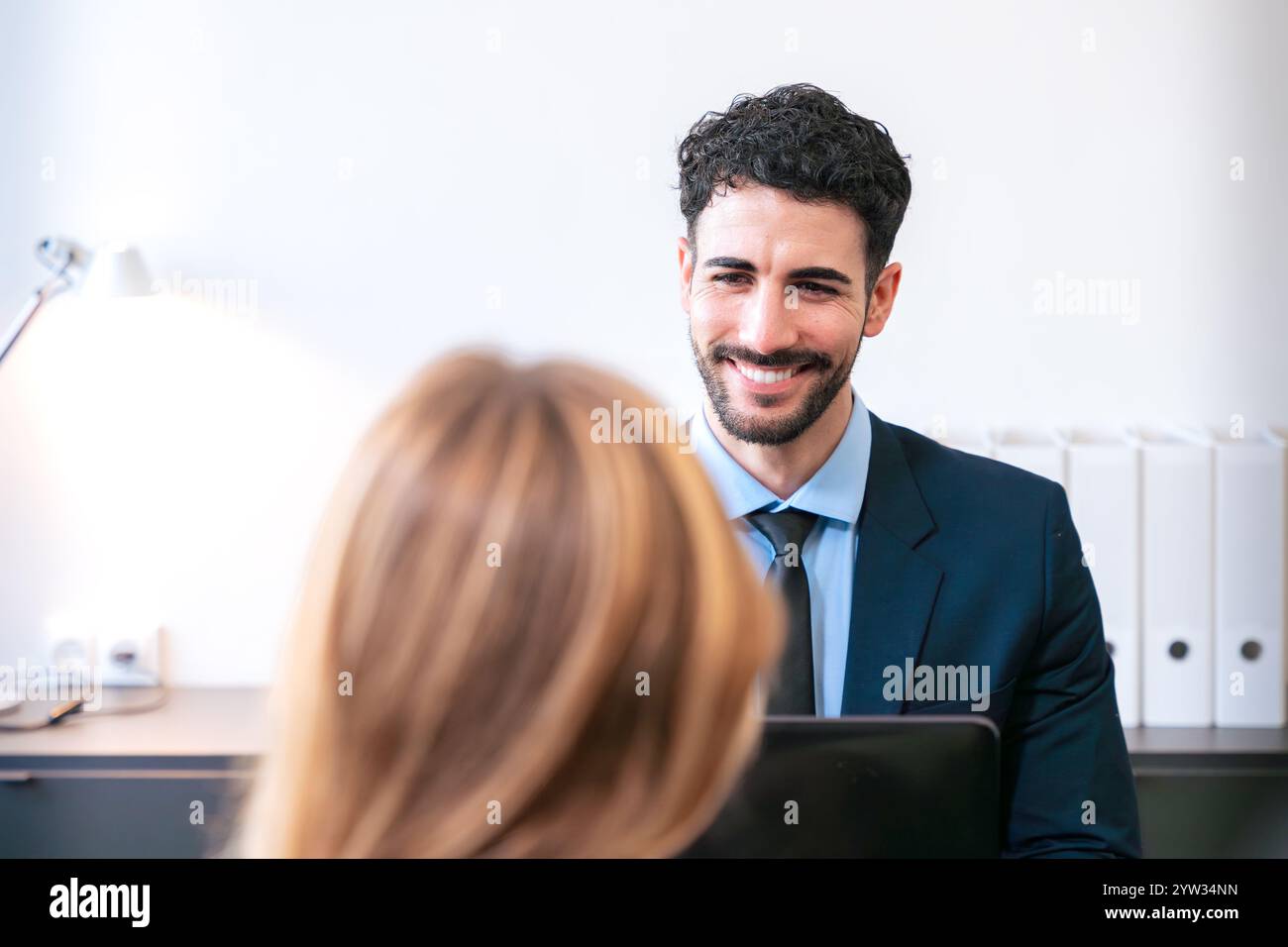 Professional business meeting between two colleagues in a bright office ...