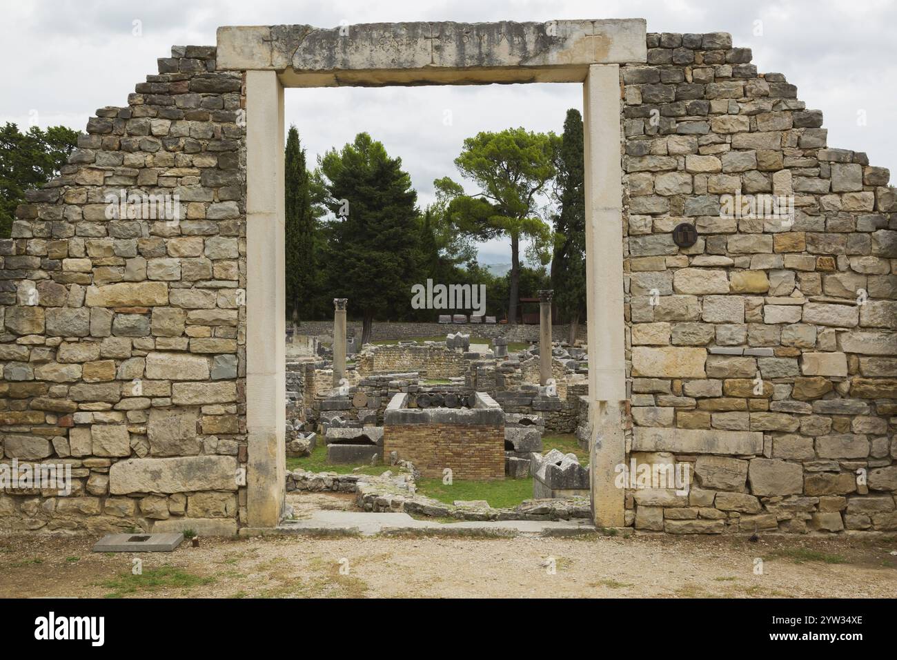 Old stone wall structure with entrance gate at ancient 3rd century ...