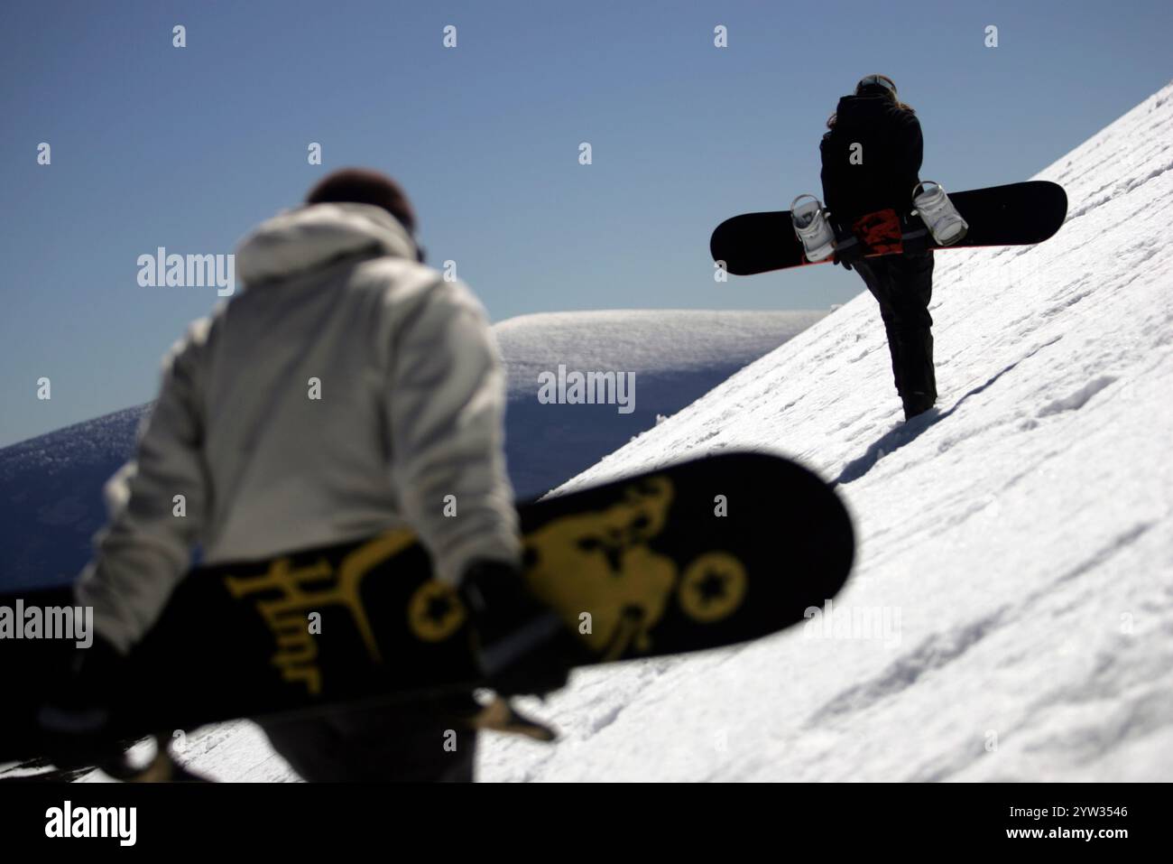 Murielle Ribot and Olivier Alluis carrying up snowboards for their ...