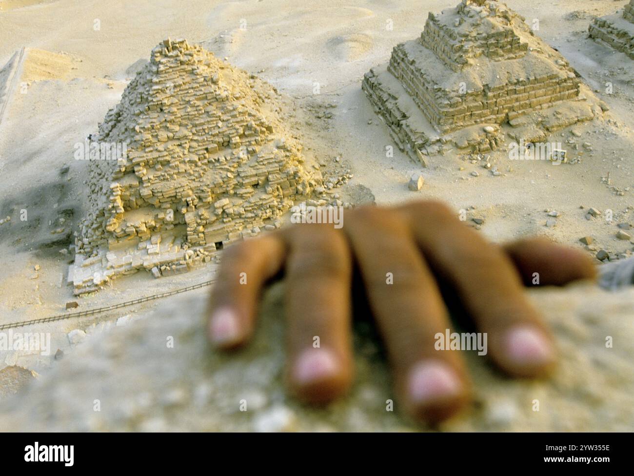 The hand of a local on the pyramid of Menkaure, Giza plateau, Egypt ...