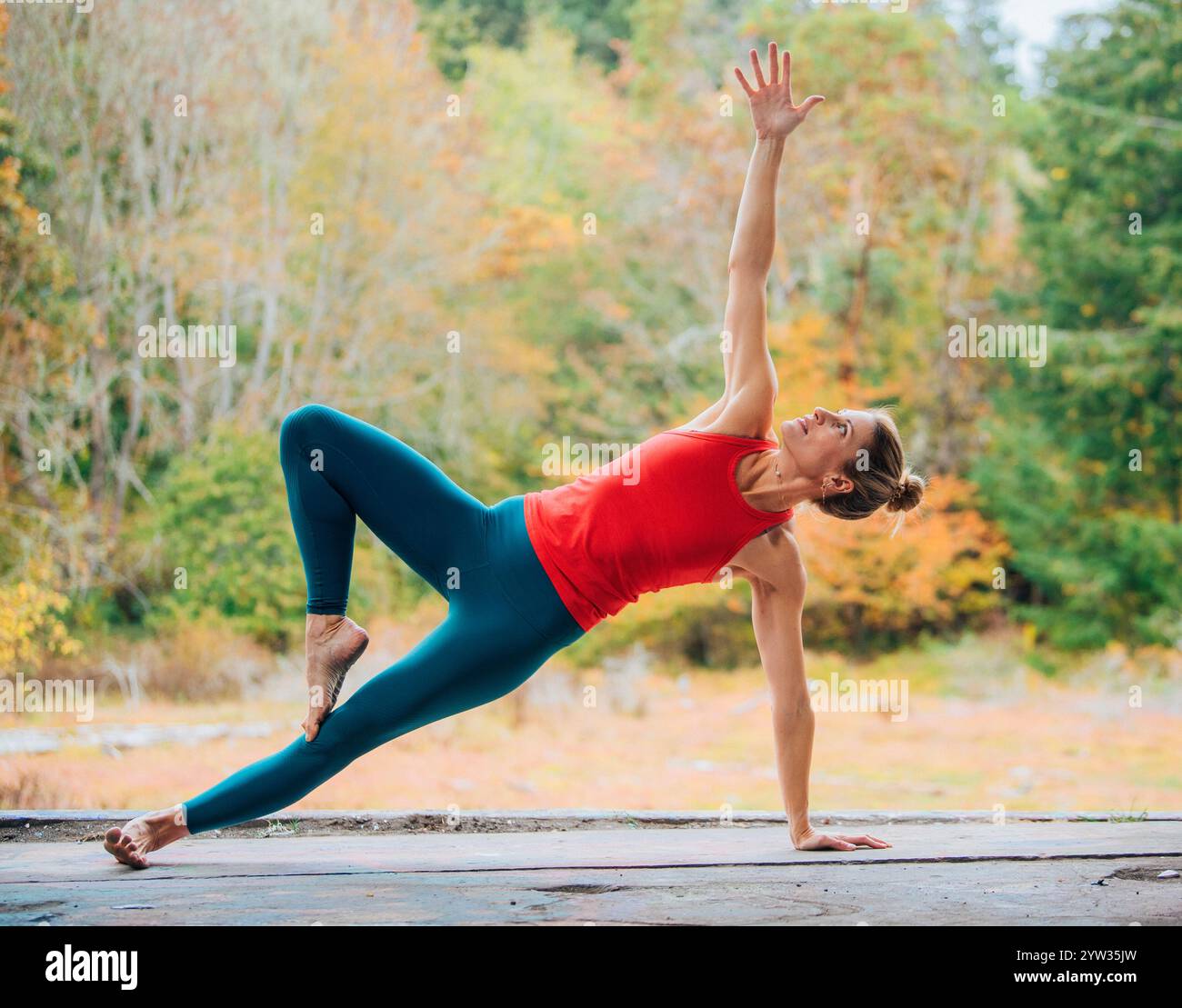 Woman performs plank exercise in hi-res stock photography and images ...