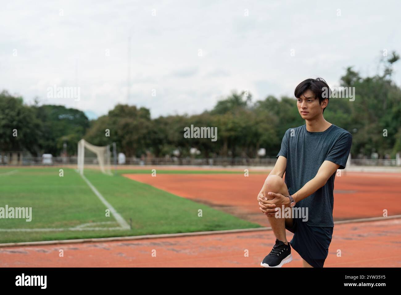 Athlete stretching routine local track field photographic scene outdoor ...