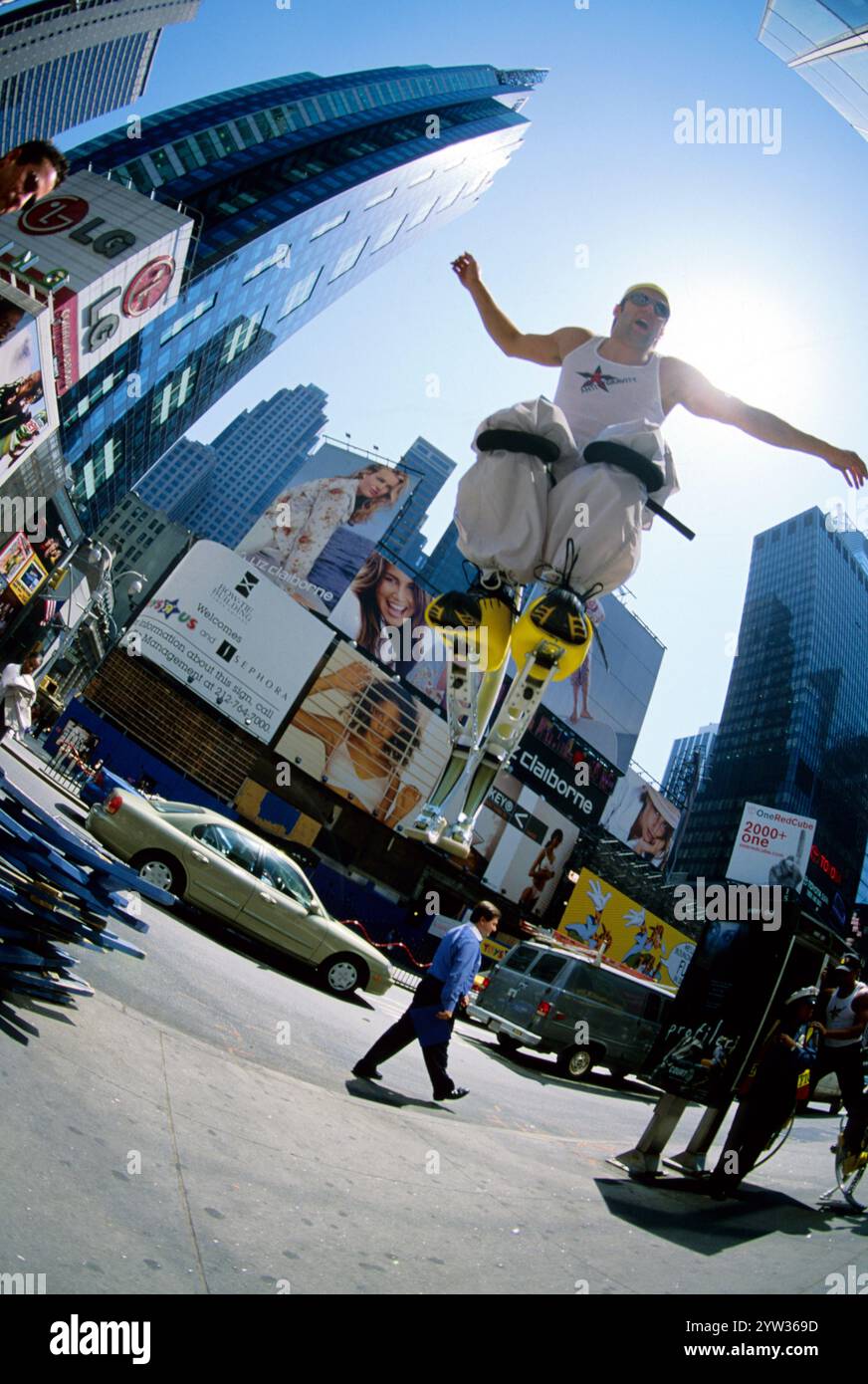 A performer presenting his new bouncing shoes on Broadway avenue, New ...