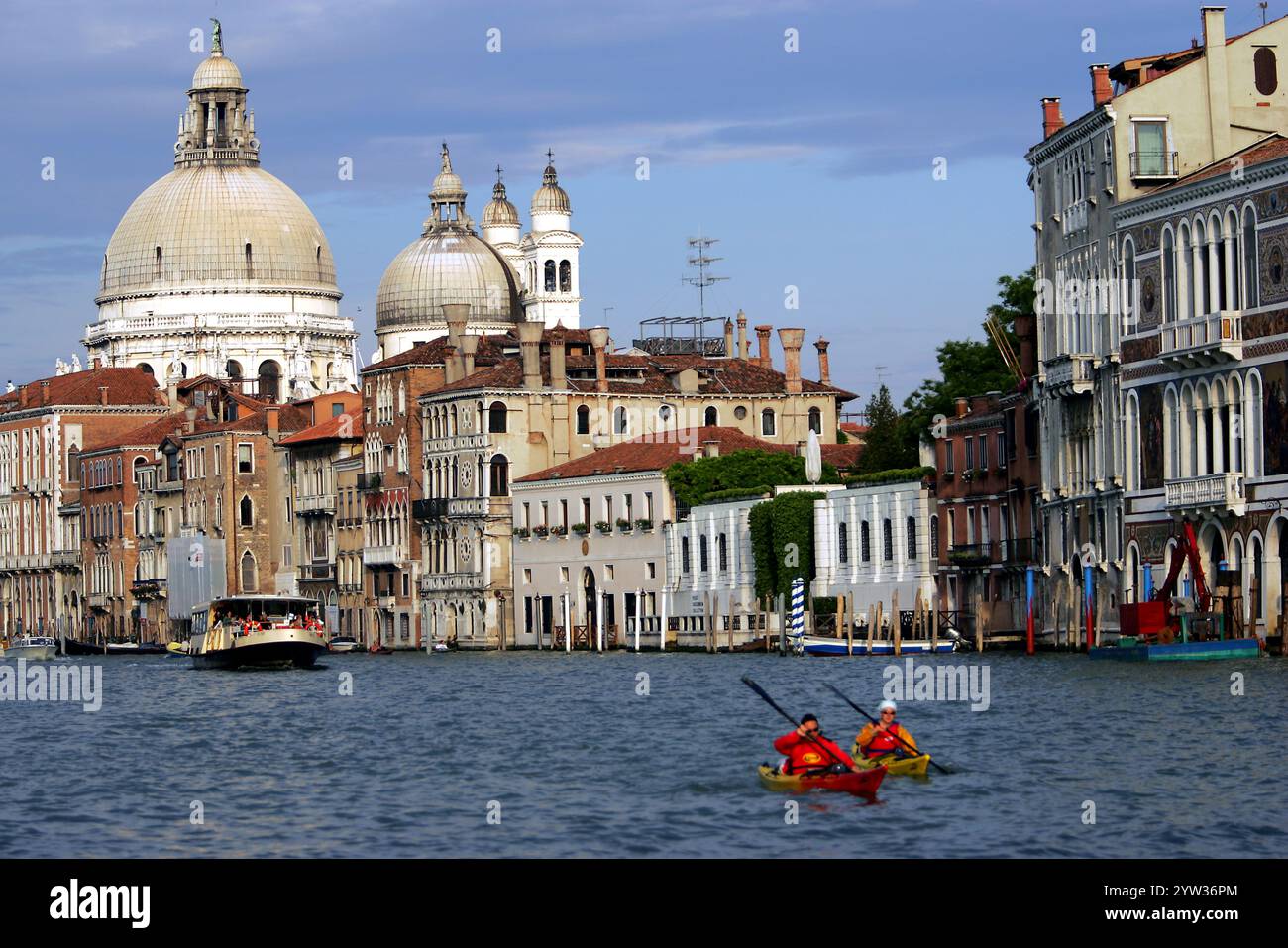 A young couple sea kayak on the Grand Canal in Venice, Italy Stock ...