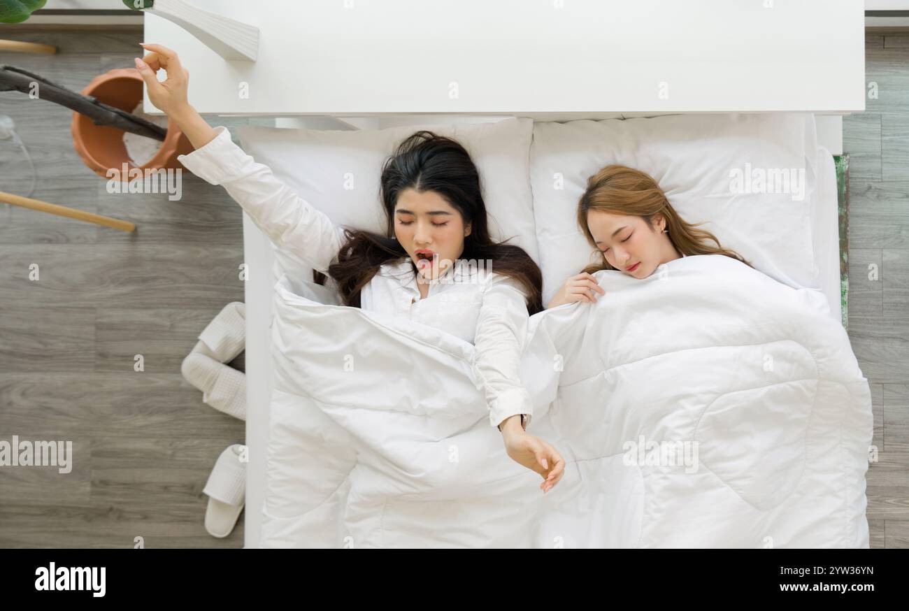 Young asian woman in white pajama, sleep and sweet dream lying with ...