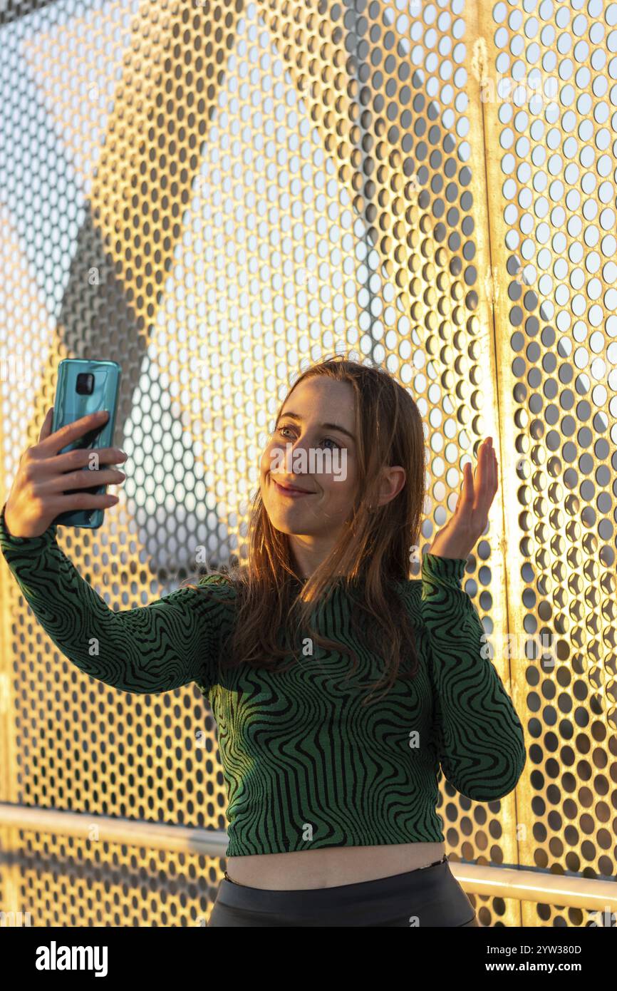 Vertical video woman looks phone hi-res stock photography and images ...