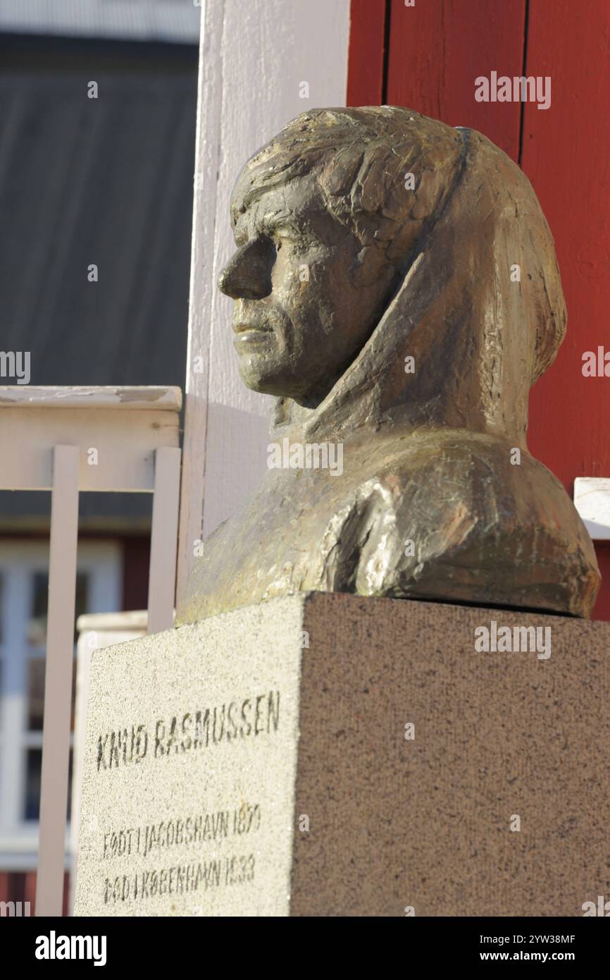 Bust of arctic explorer Knud Rasmussen, in front of museum, Ilulissat ...
