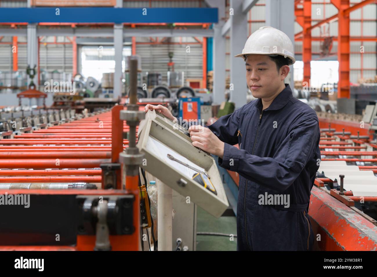 Professional engineer managing production line hi-res stock photography ...
