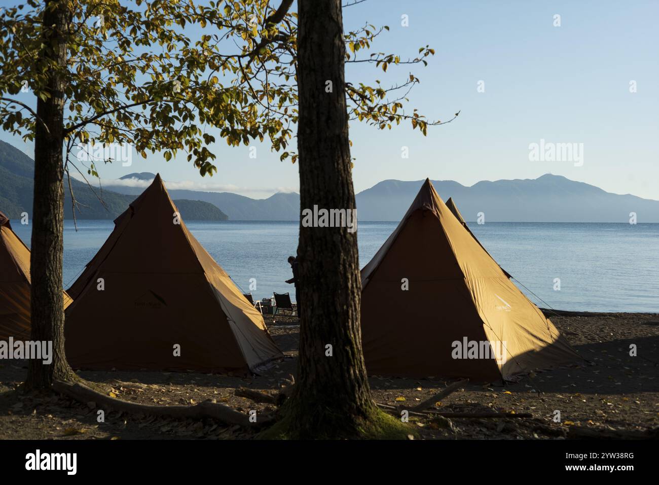 Tents with mountains in the background, Shikotsu-Lakeside Bifue ...