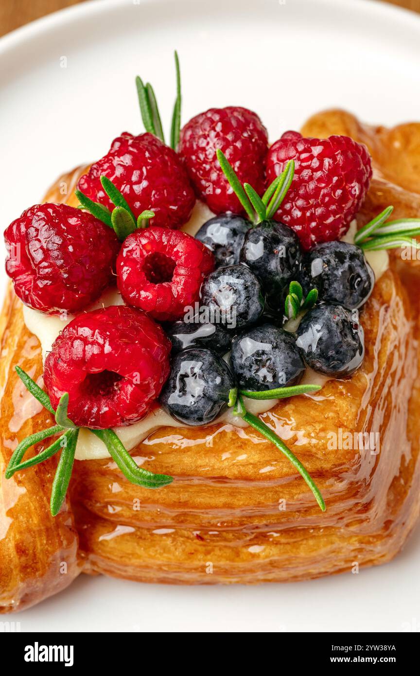 puff pastry dessert with cream and berries in the shape of a bow Stock ...