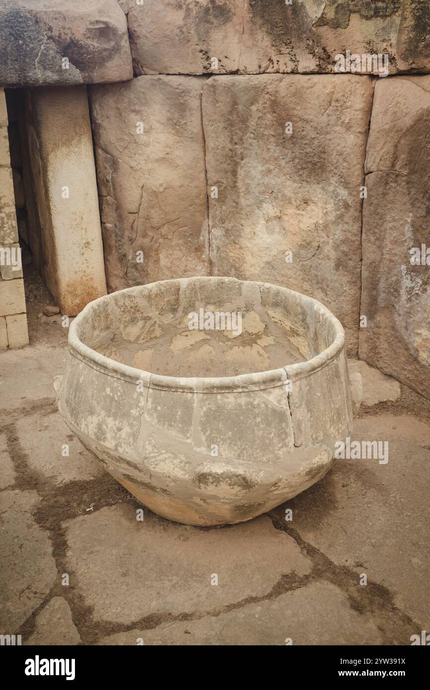 An ancient stone cauldron in a temple Stock Photo - Alamy