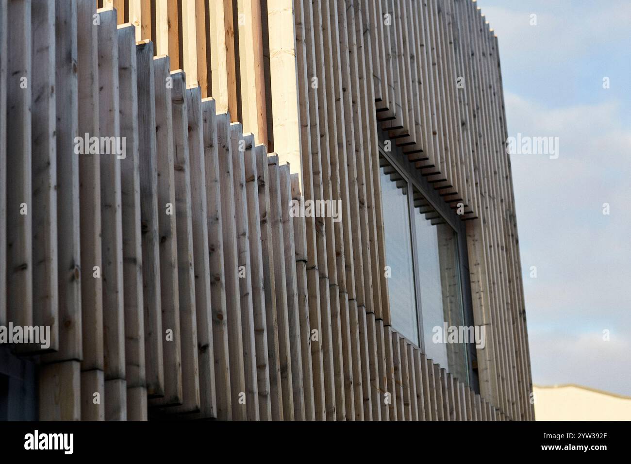 Modern architecture detail showing vertical louvers and a large window ...