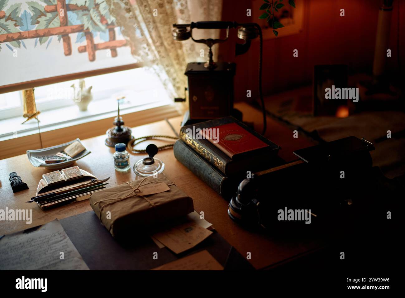 Vintage desk with antique telephone, writing materials, and ornate ...