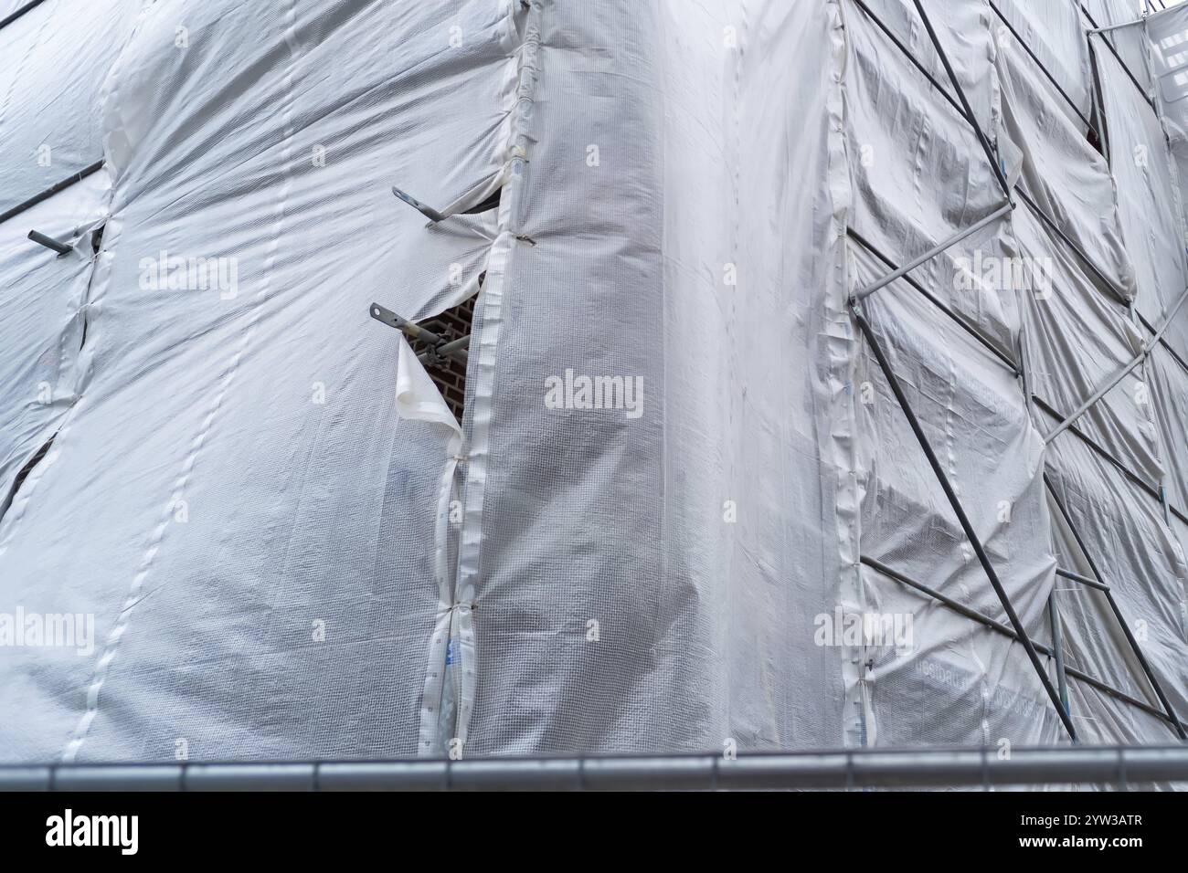 Building covered with a tarpaulin Stock Photo - Alamy