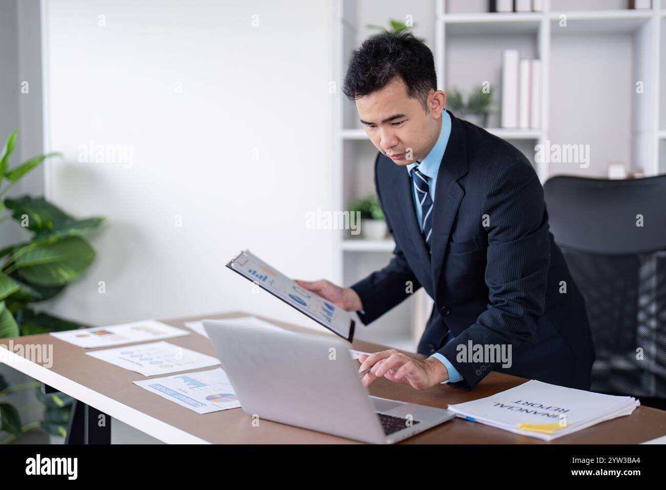 Business professional engaging in data analysis modern office digital ...